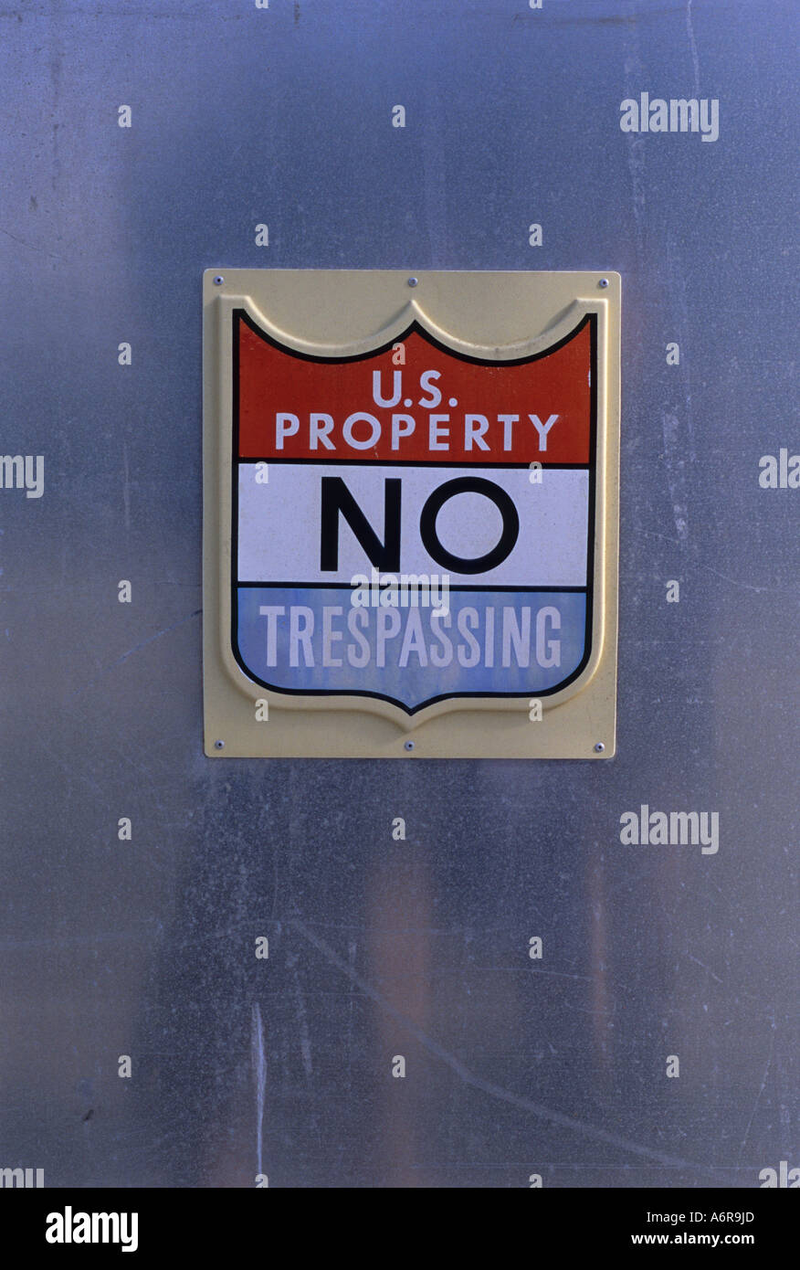 "U.S. Property "No Trespassing" sign on an "electrical installation ...