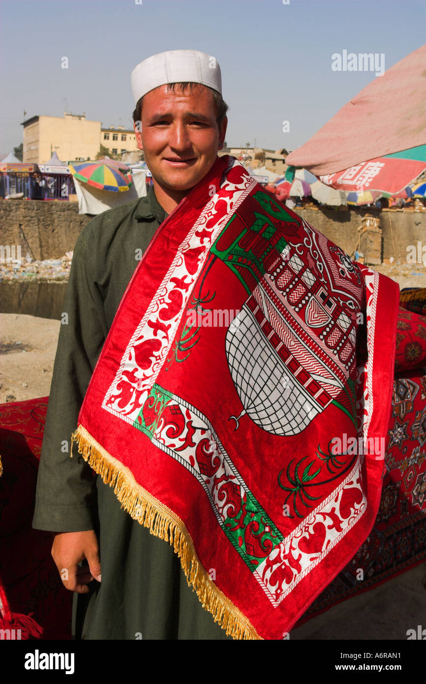 AFGHANISTAN Central Kabul Man selling rugs on banks of Kabul river ...