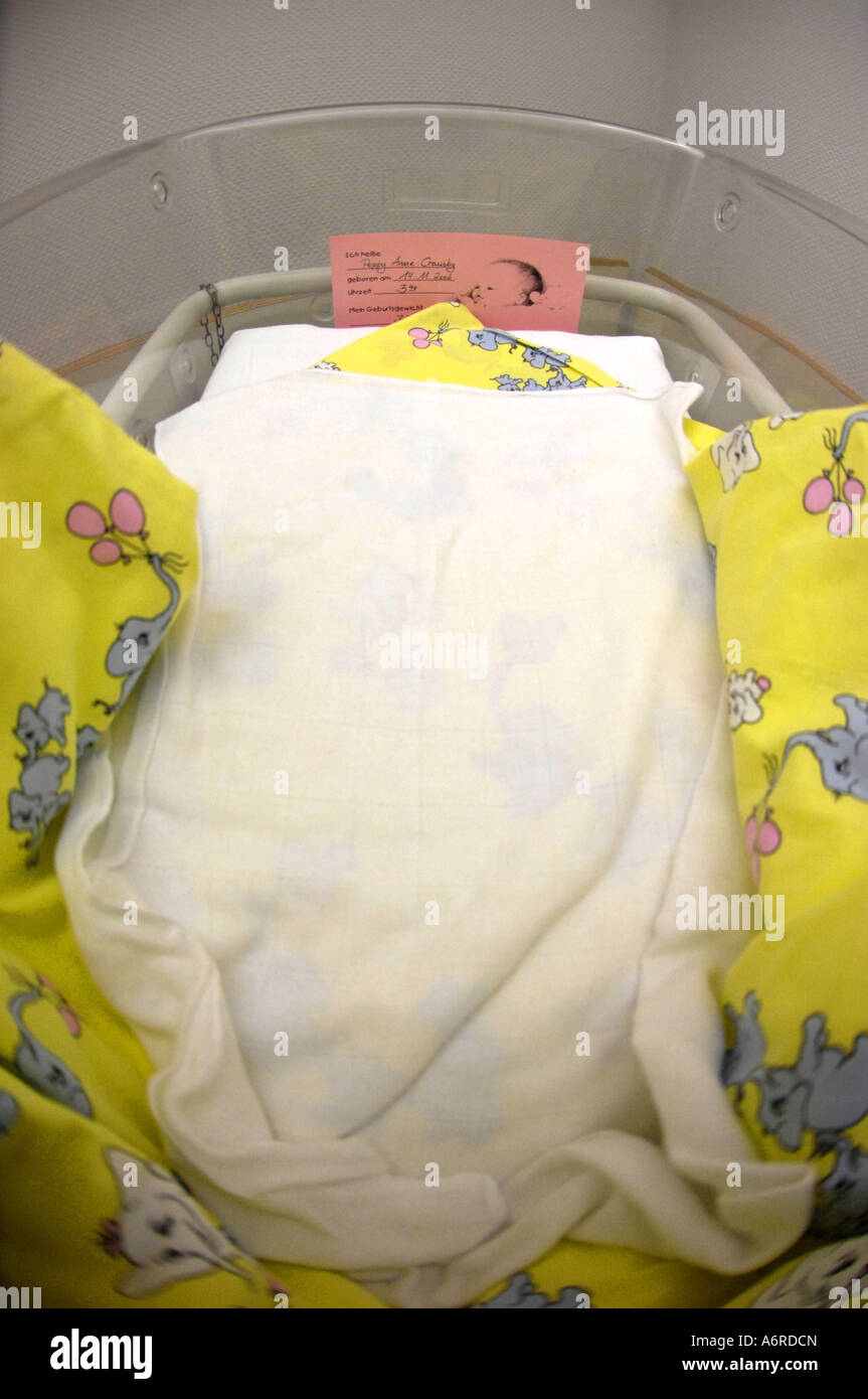 newborn girls sleeping mobile perspex cot bed german hospital Stock ...