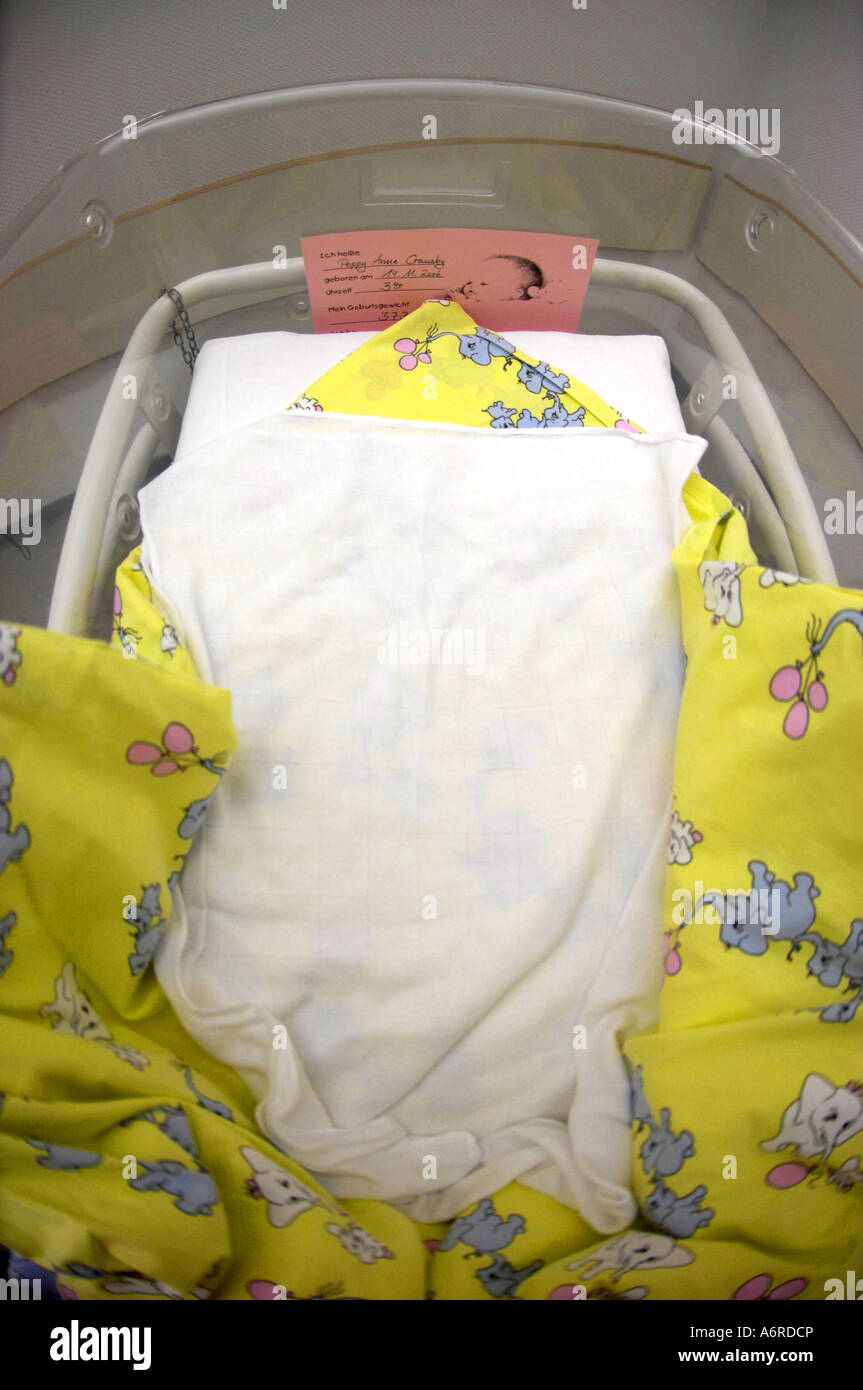 newborn girls sleeping mobile perspex cot bed german hospital Stock ...