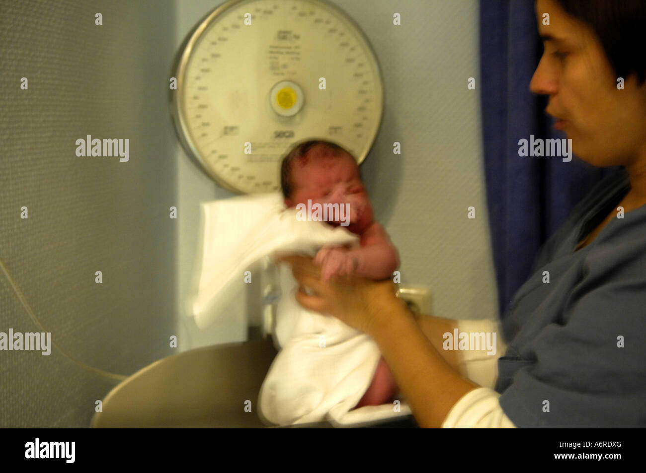 Birth baby midwife weighing hi-res stock photography and images - Alamy