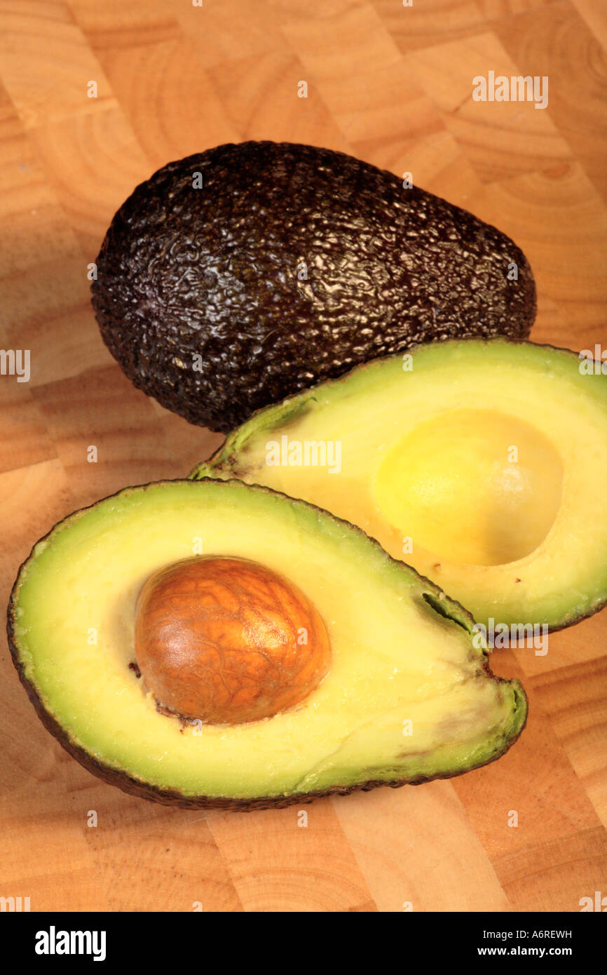 Avacados with stone Stock Photo - Alamy