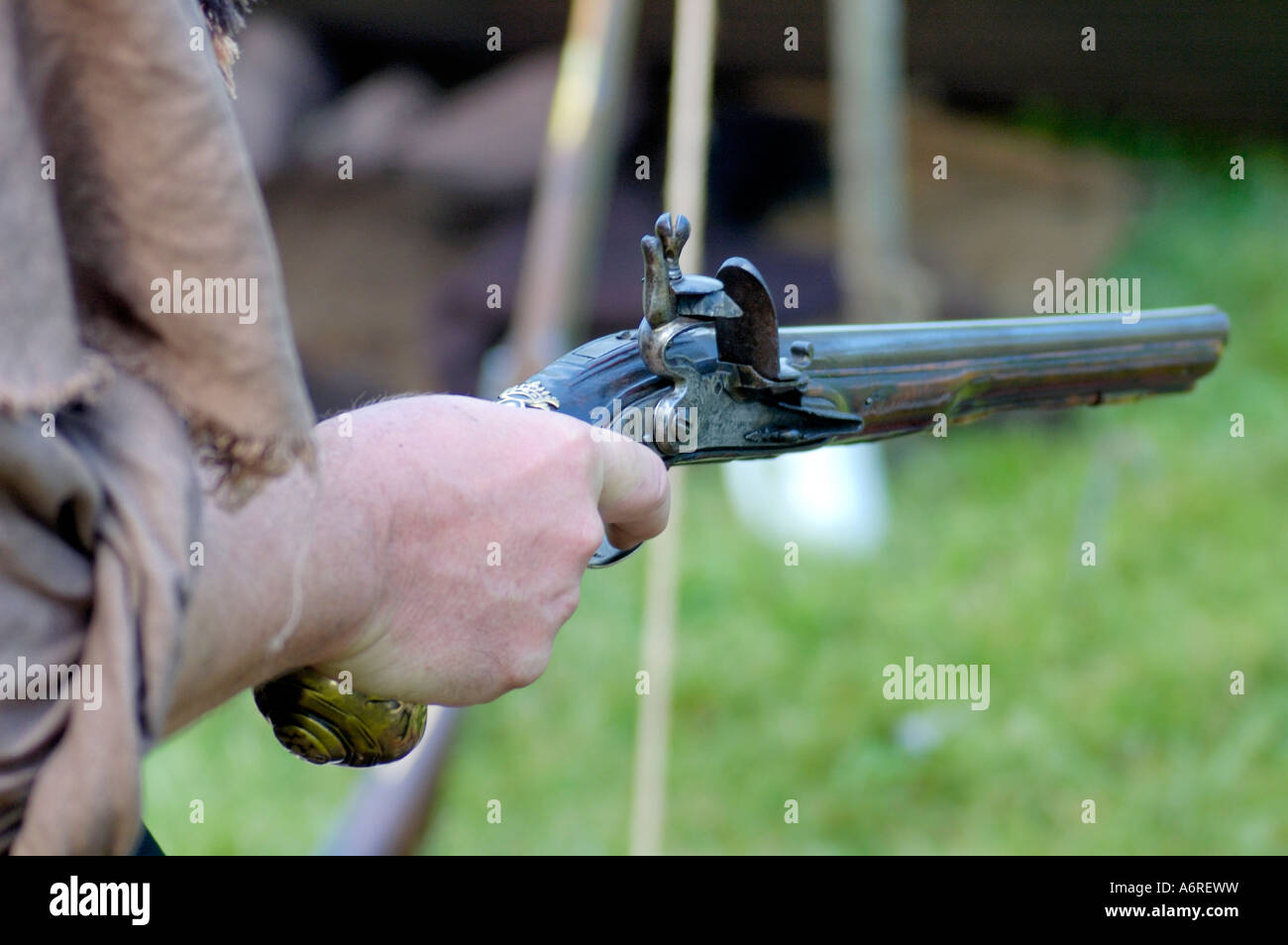 Old Kentucky flintlock pistol being held in a hand Stock Photo - Alamy