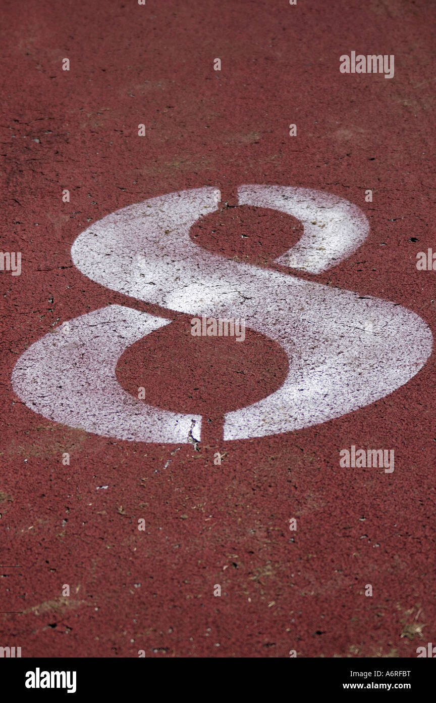 Number 8 in white paint on red surface of a asphalt track Stock Photo ...