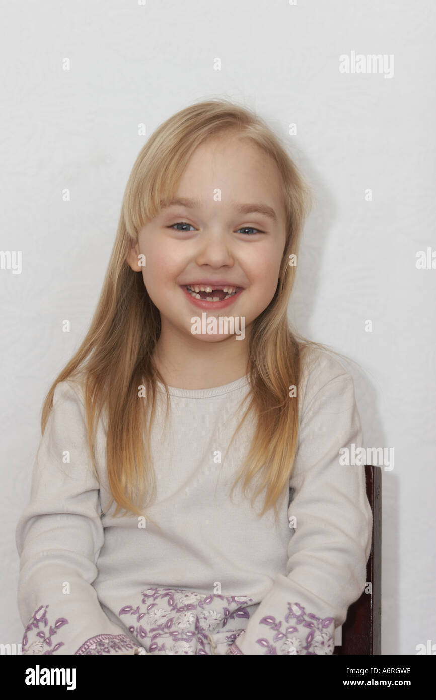 Smiling blonde girl missing tooth hi-res stock photography and images - Alamy