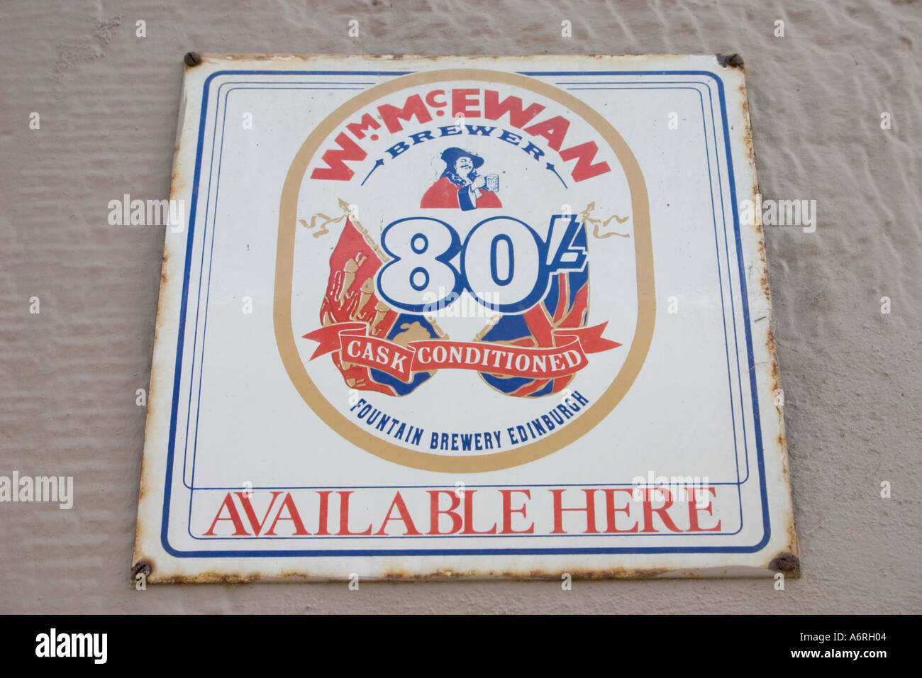Old sign for McEwans 80 shilling ale strong Scottish beer on side of ...