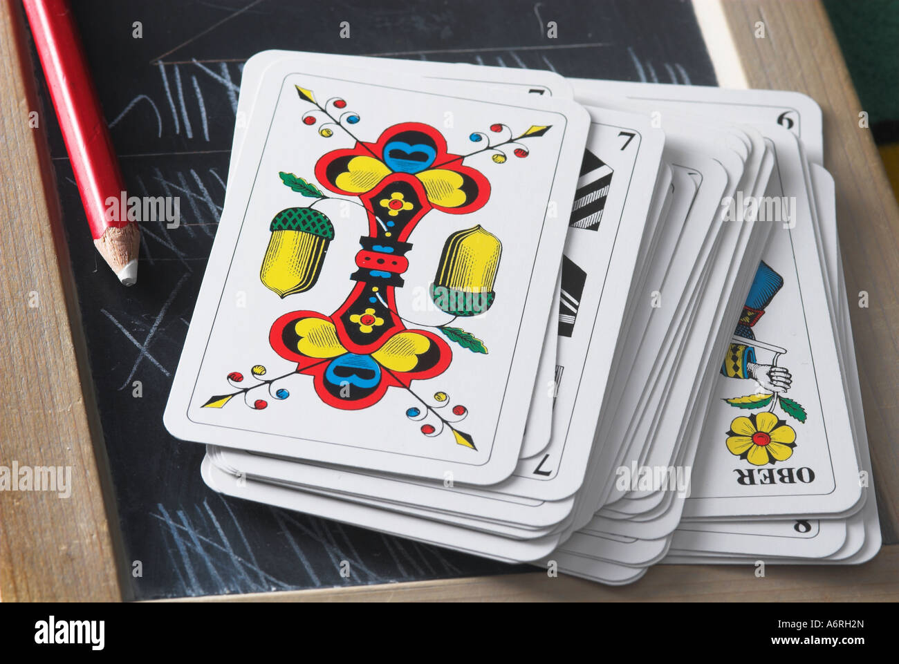 swiss card deck on a blackboard Stock Photo - Alamy