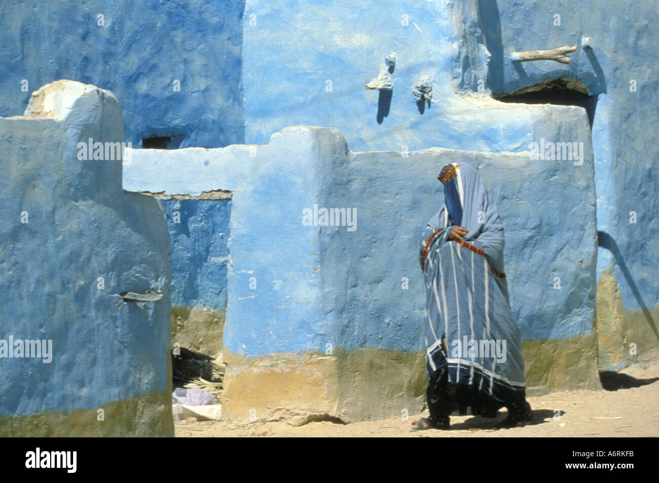 Africa, Egypt, Siwa Oasis, Wrapped in traditional blue woven, brocade ...