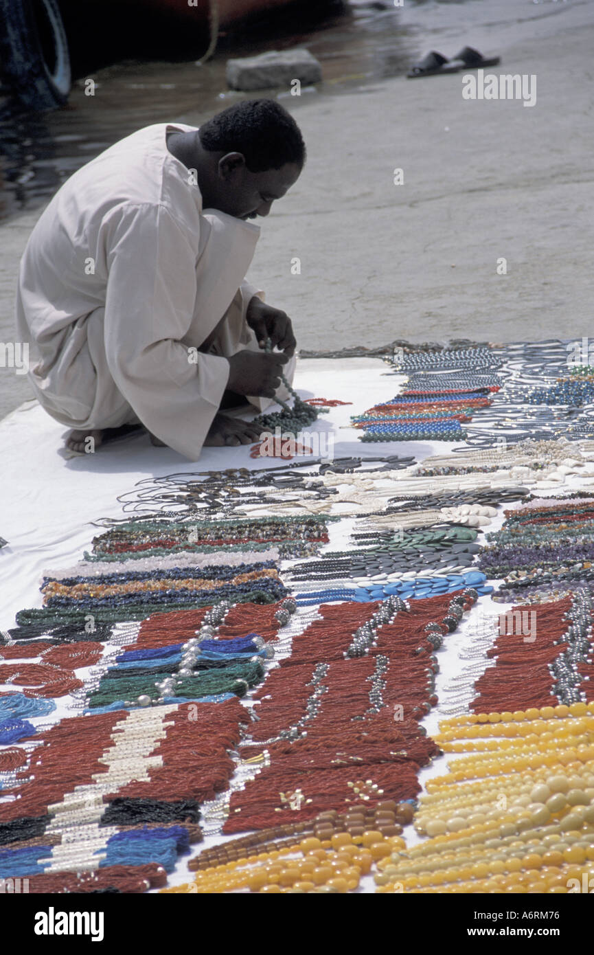 Africa, Egypt, Aswan, Lake Nasser. Nubian jewelry vendor at boat ...