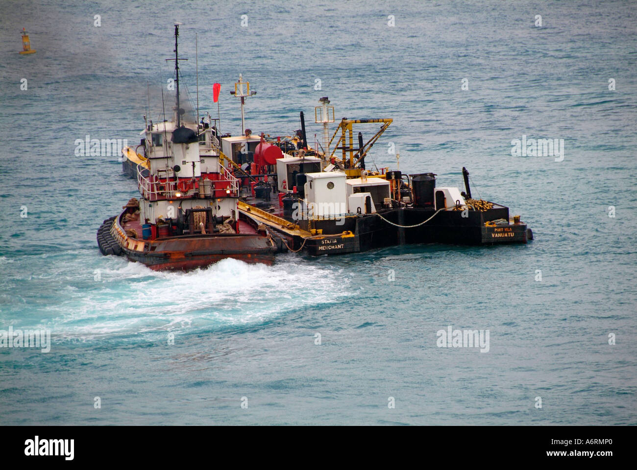 Tug boats services cruise ship liner at St Maarten Martin Island in the ...