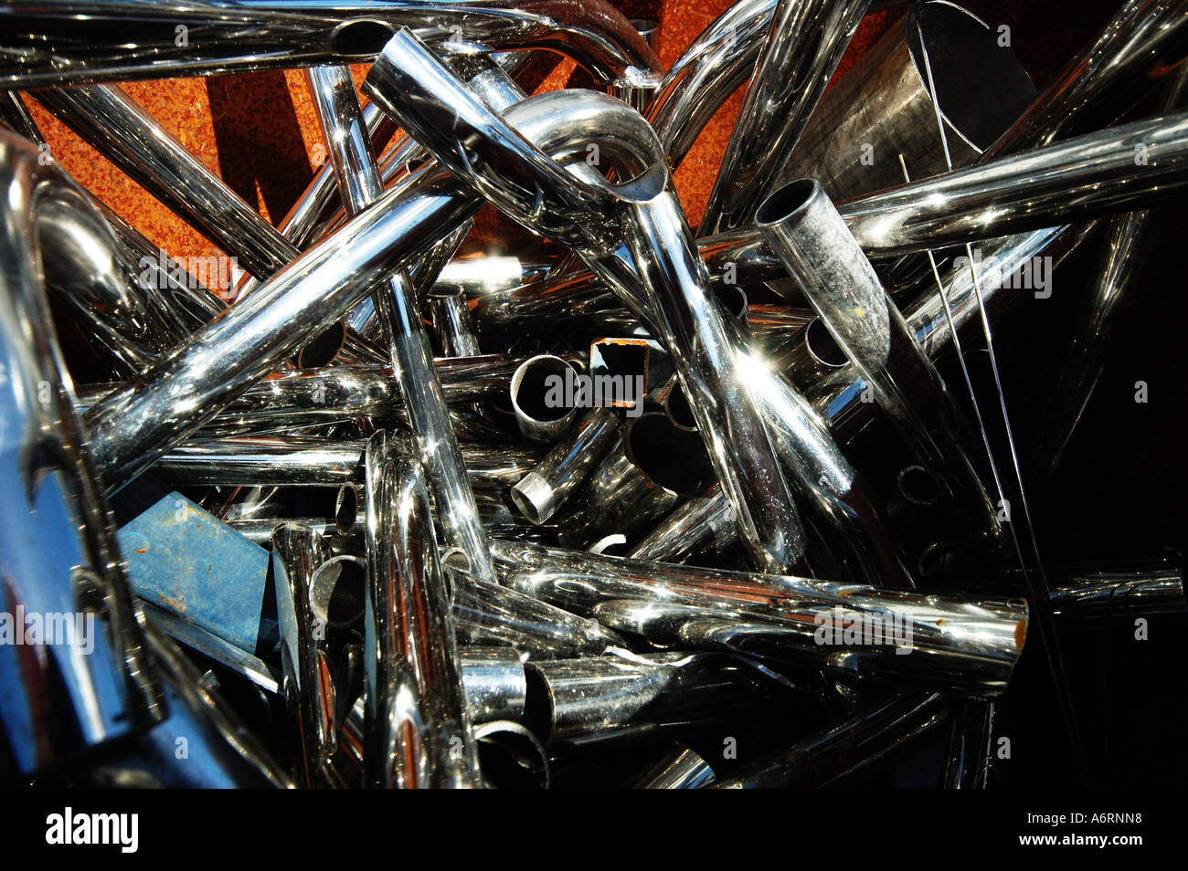 tangle of stainless steel pipe in recycle bin Stock Photo - Alamy