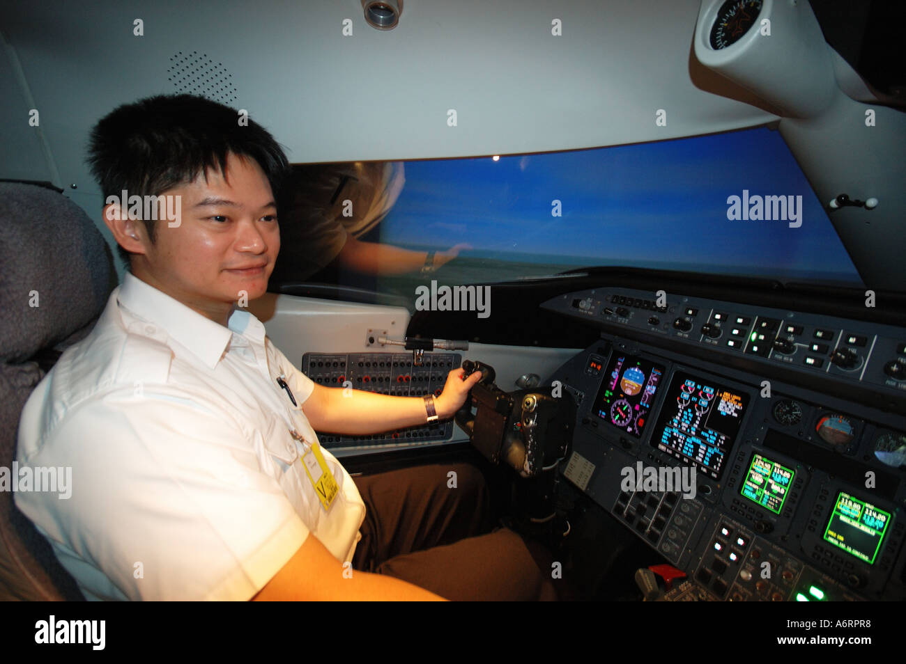 trainee pilot in flight simulator of commercial passenger jet Stock ...