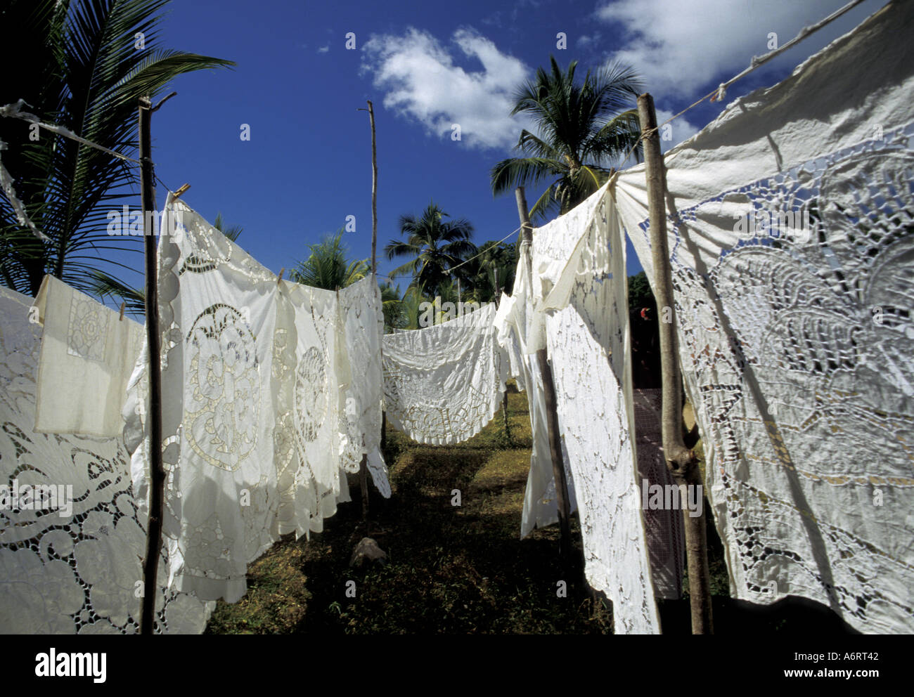 Africa, Madagascar, Nosy Komba. Embroidered table clothes and bed ...