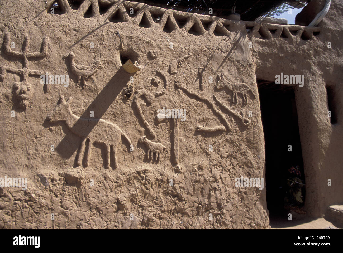 Africa, Mali, Dogon Region. Building decorated with traditional symbols ...