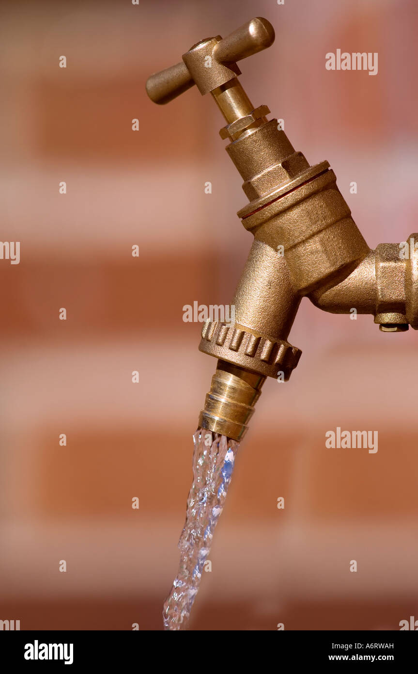 Brass garden Tap with running water Stock Photo - Alamy