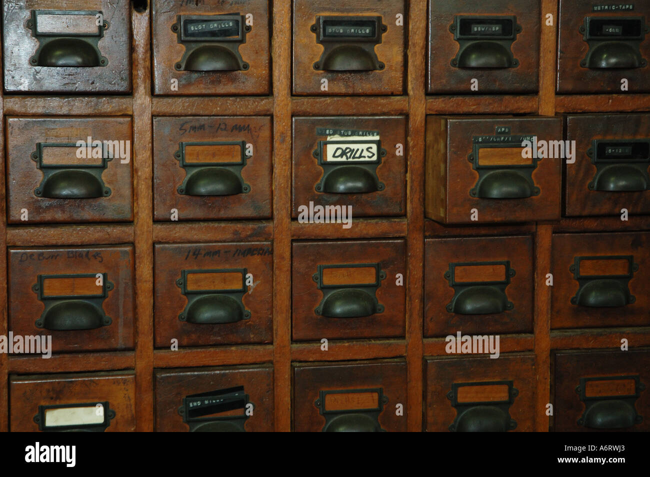 old timber card file cabinet used for tool storage Stock Photo - Alamy