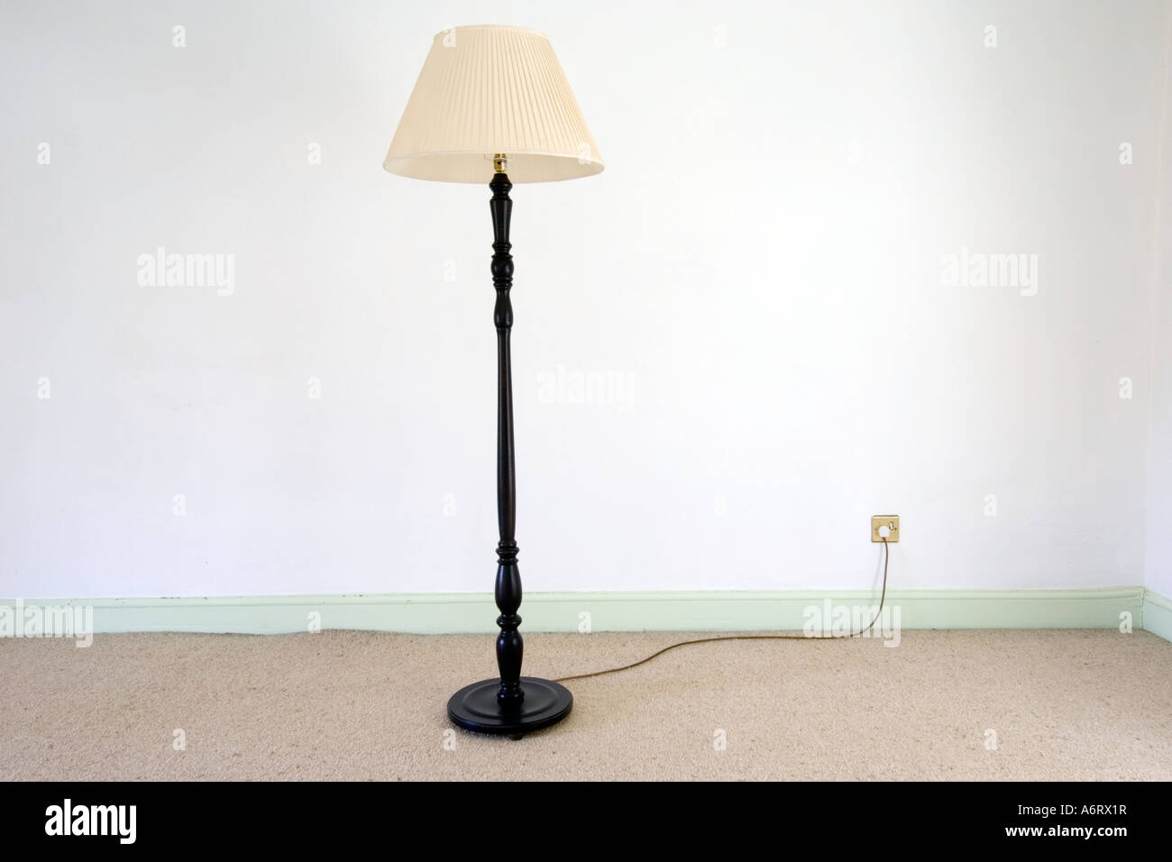 standard lamp in an empty room Stock Photo - Alamy