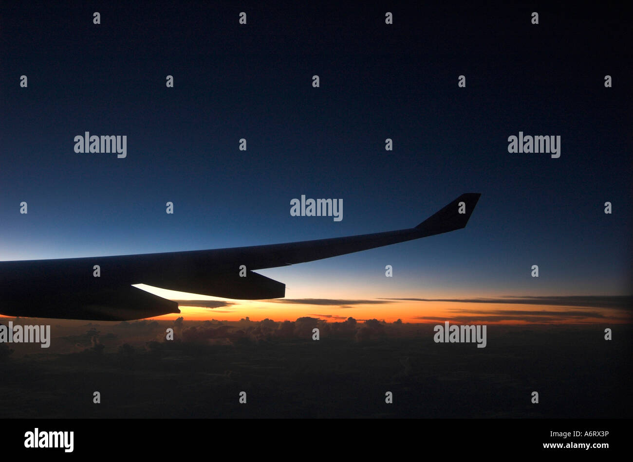 Aircraft wing and sunset from the cabin window Stock Photo - Alamy