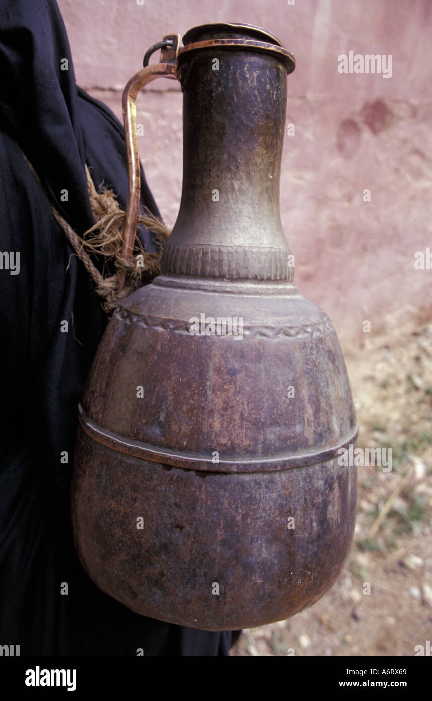 Africa, Morocco, Ameln Valley Traditional copper water jug is carried ...