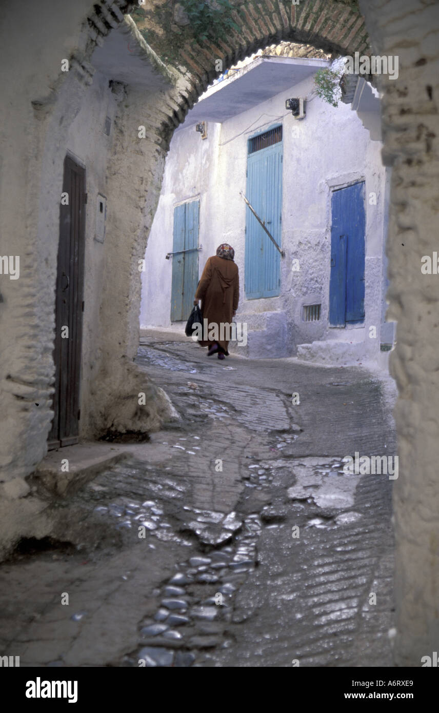 Africa, Morocco, Chefchaouen (aka Chaouen), Woman in traditional dress ...