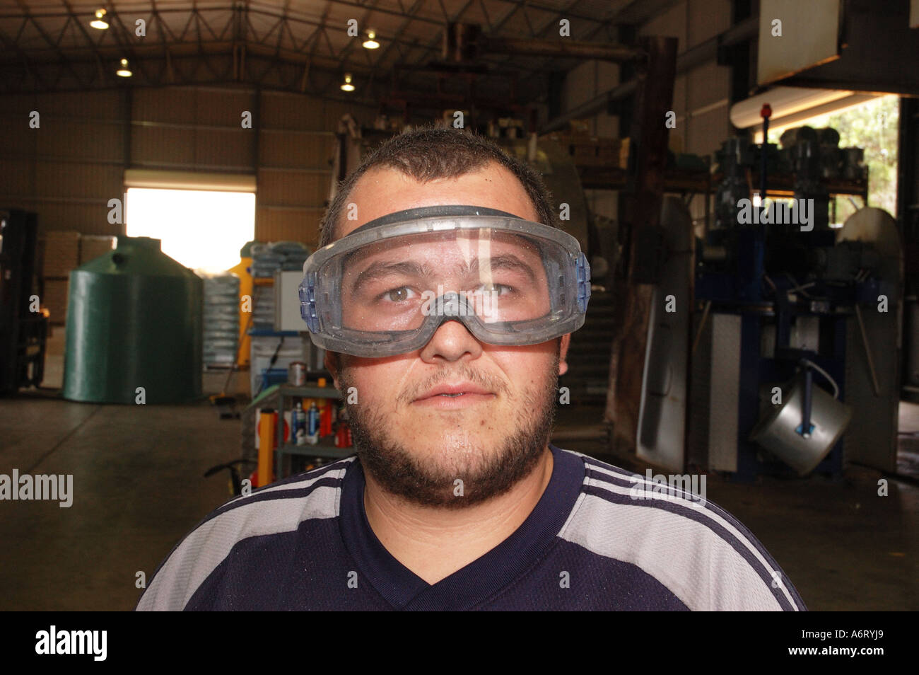 Factory worker wearing high impact safety goggles glasses Stock Photo ...