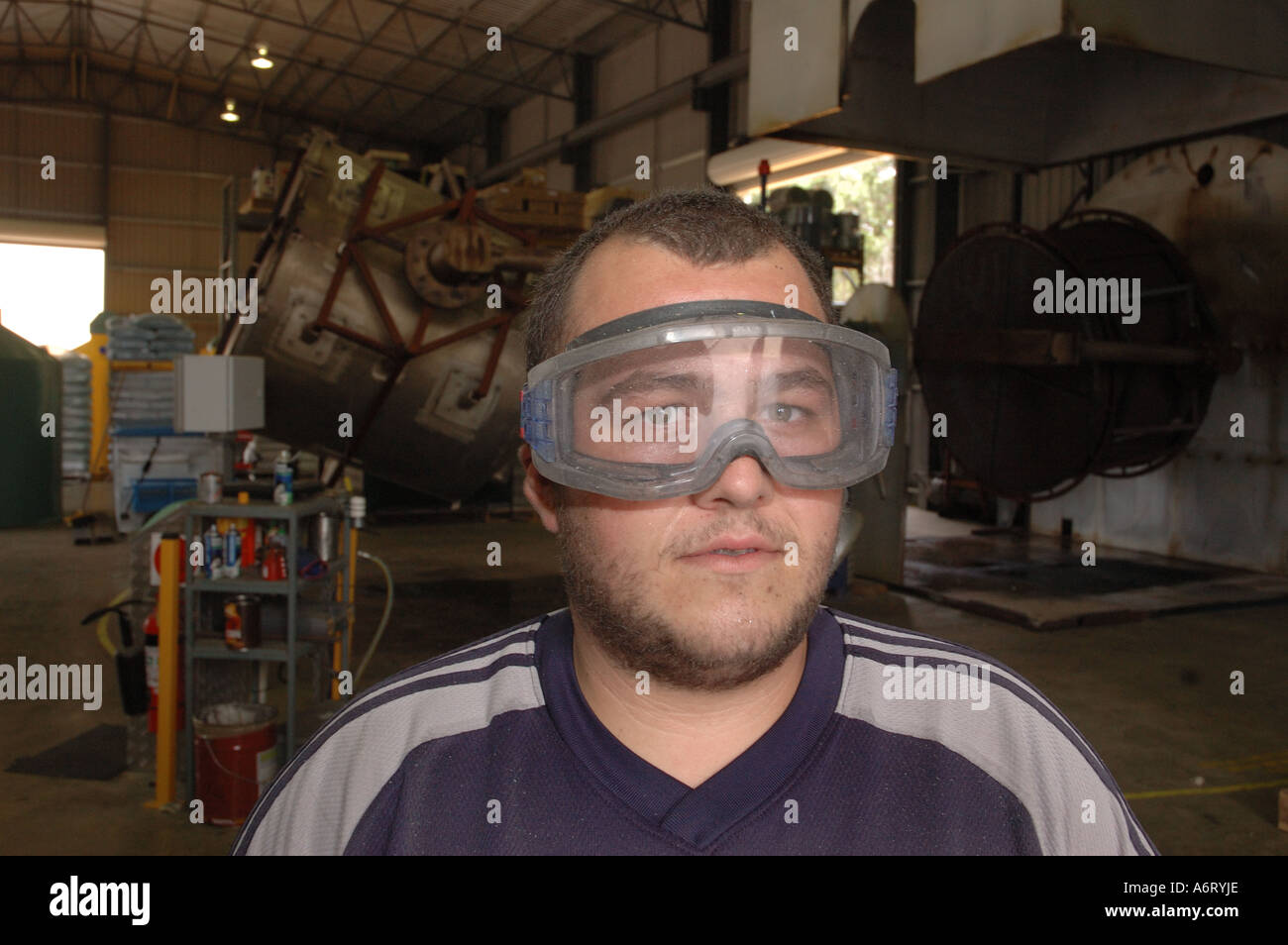 Factory worker wearing high impact safety goggles glasses Stock Photo ...
