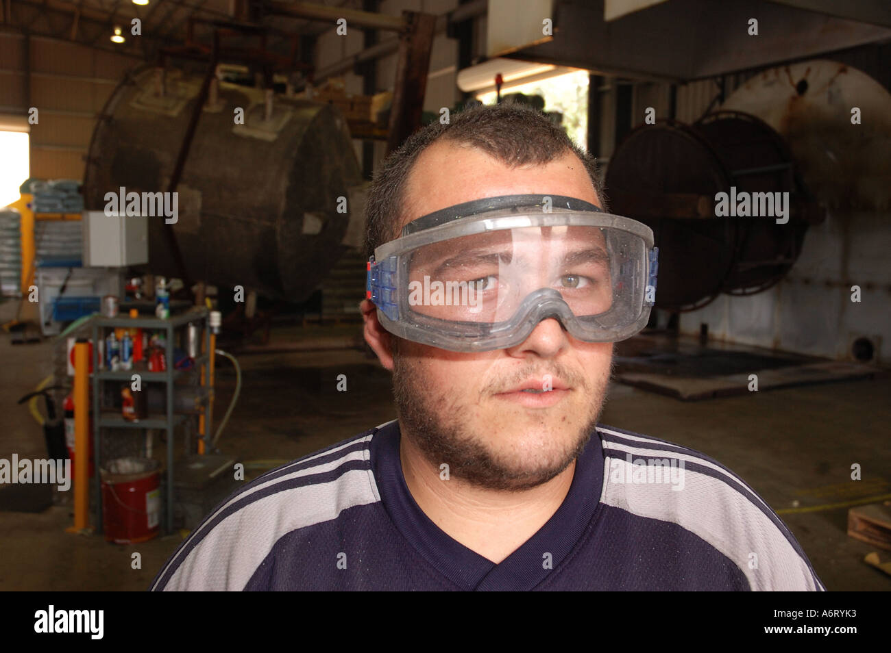 Factory worker wearing high impact safety goggles glasses Stock Photo ...