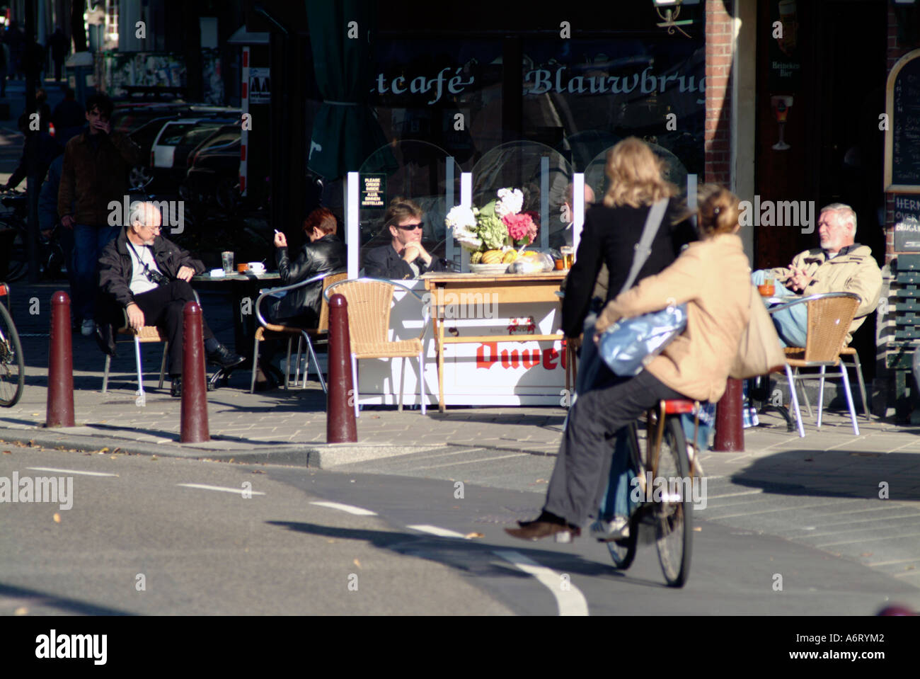 Hitching a ride on a bicycle Amsterdam Stock Photo - Alamy