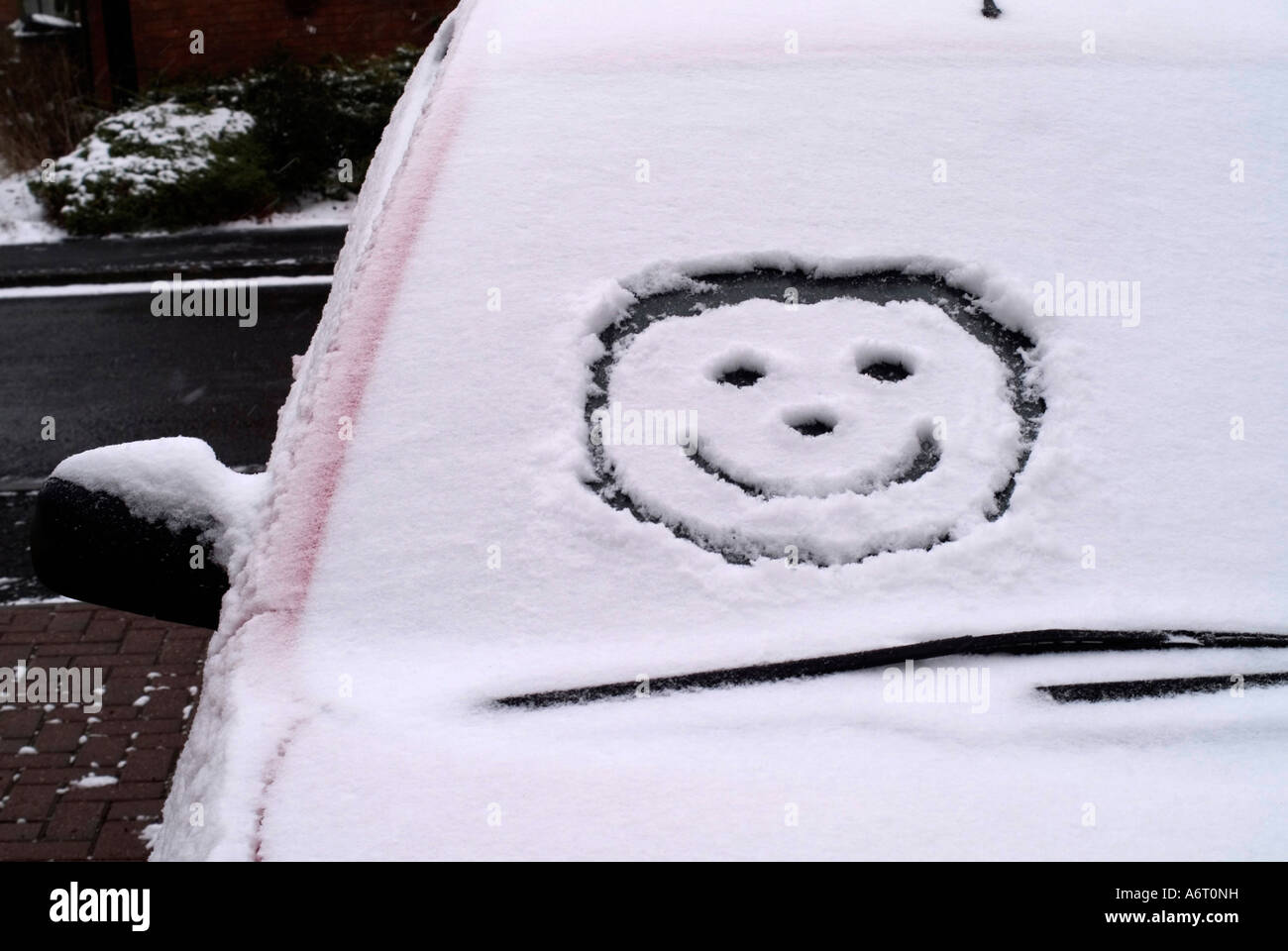 Smiley face in snow on car hi-res stock photography and images - Alamy