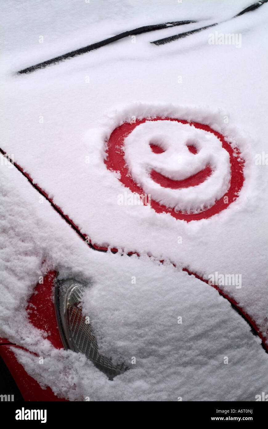 face in snow on car Stock Photo - Alamy