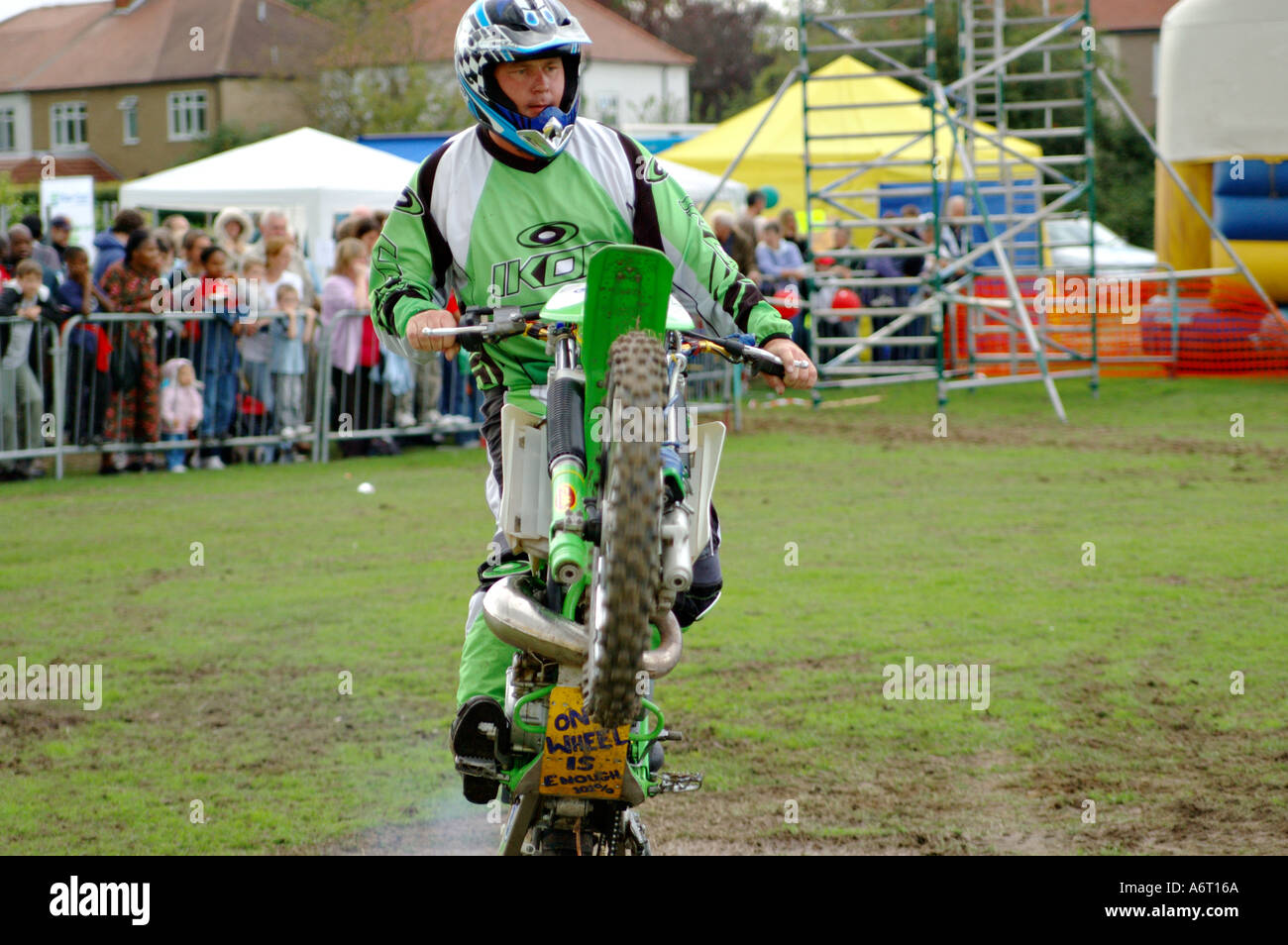Motorbike stunt long wheelie Stock Photo - Alamy