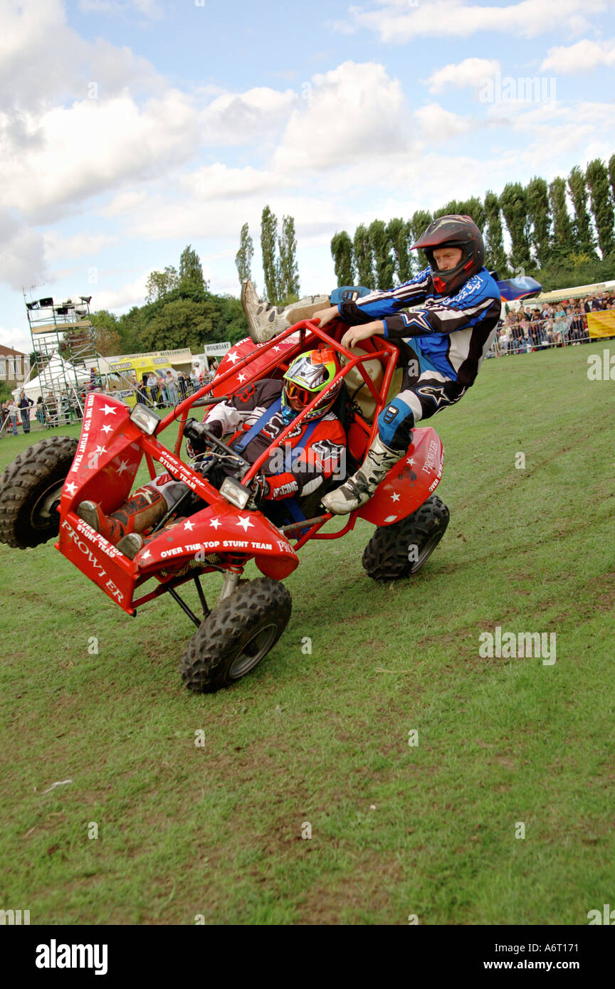 Quad bike on two wheels motorcycle stunt display team Stock Photo - Alamy