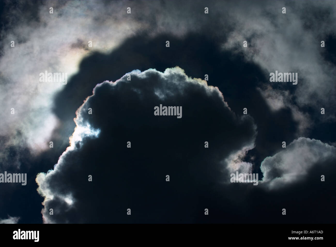 The sun behind a cloud Stock Photo - Alamy