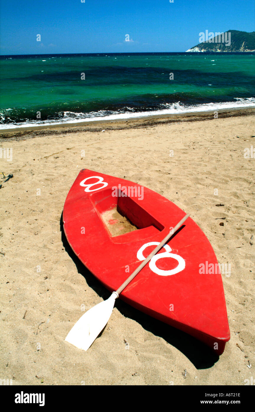 Canoe on beach at Meghalos Aselinos beach Skiathos Greece Stock Photo ...