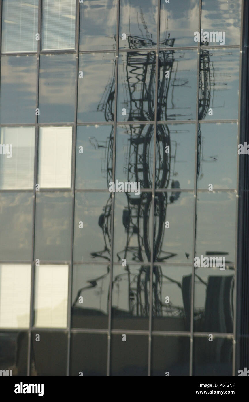 communication tower reflected in dull grey building inner city Stock ...