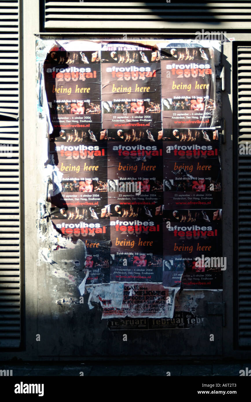 posters on wall Stock Photo - Alamy