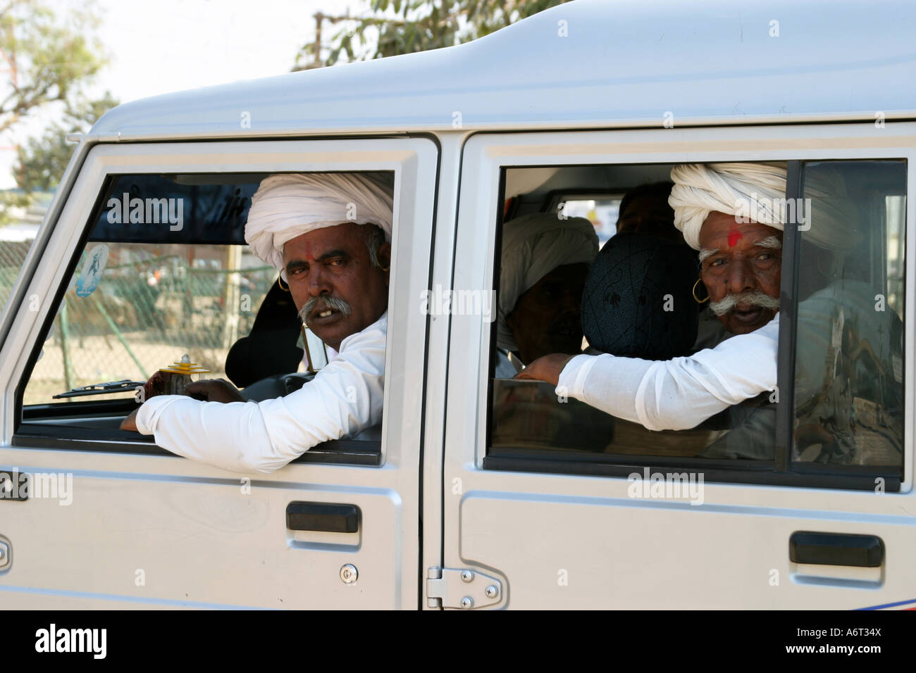 Two members of the Bharwad tribe in their traditional white outfits ...