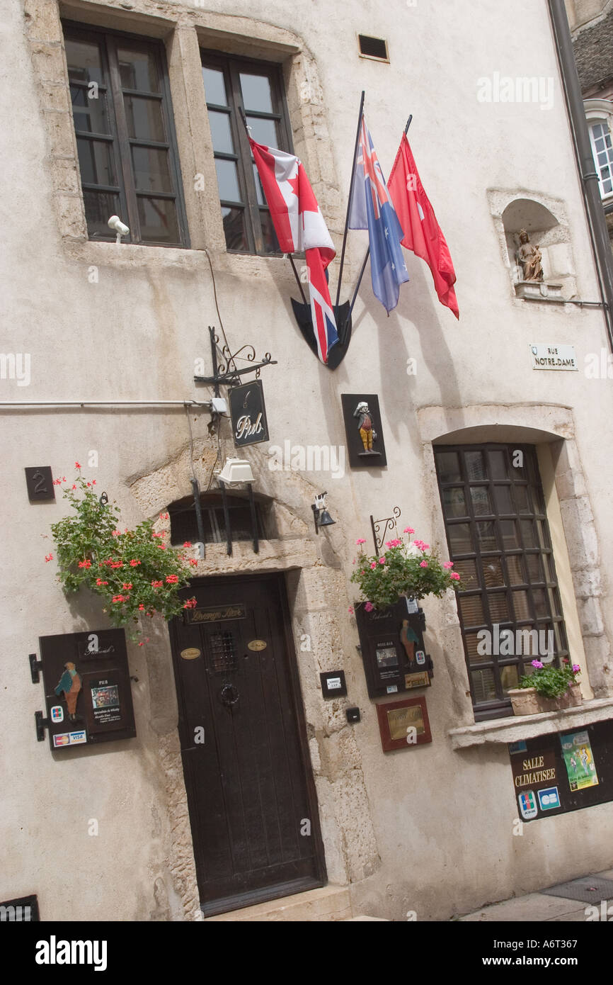 Flags on wall outside hotel in Beaune Bourgogne France Stock Photo - Alamy