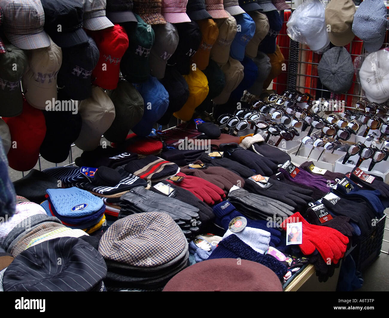 Hats, scarves, globes, and sunglasses in a street vendor's display in ...