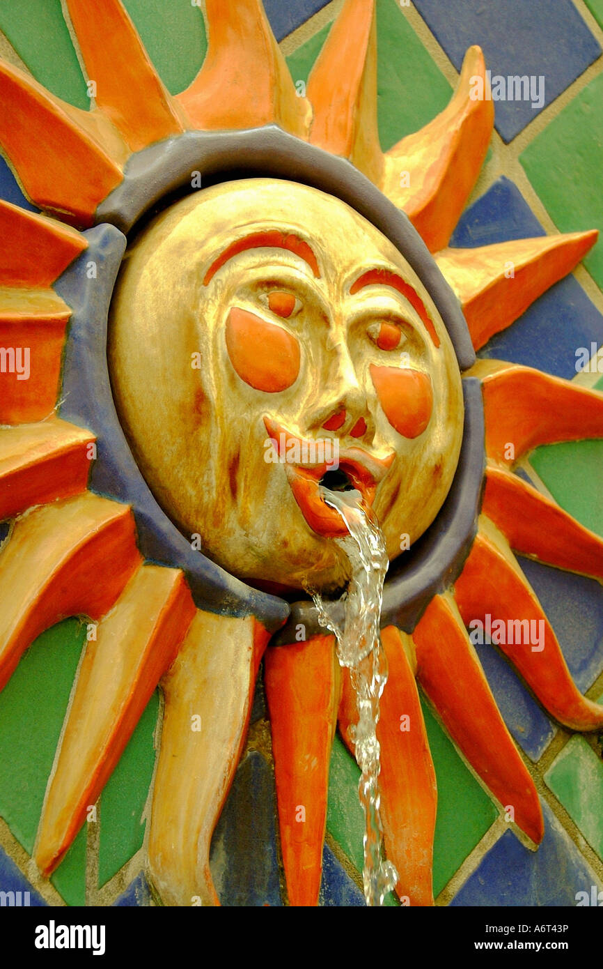 Water pouring from a sun face fountain in Santa Barbara, California ...