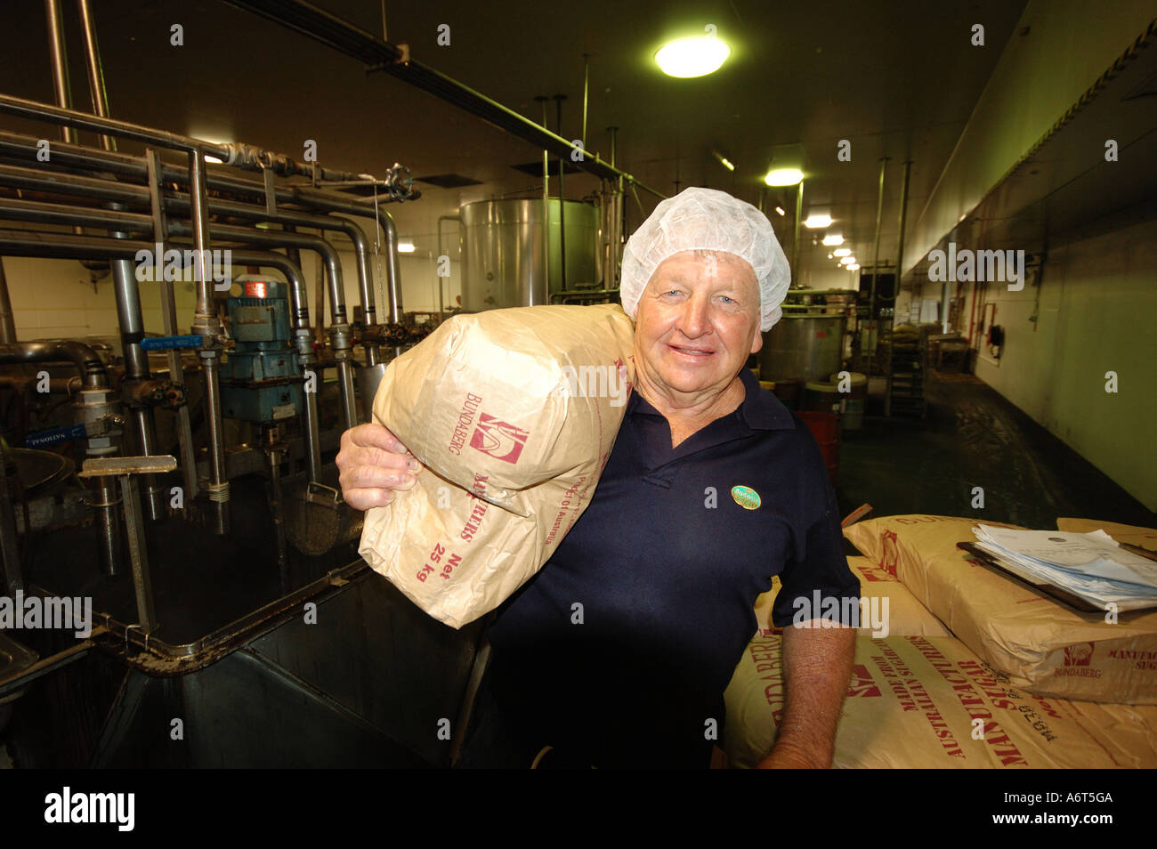 worker lifting bag of sugar ginger factory Buderim Yandina Queensland ...