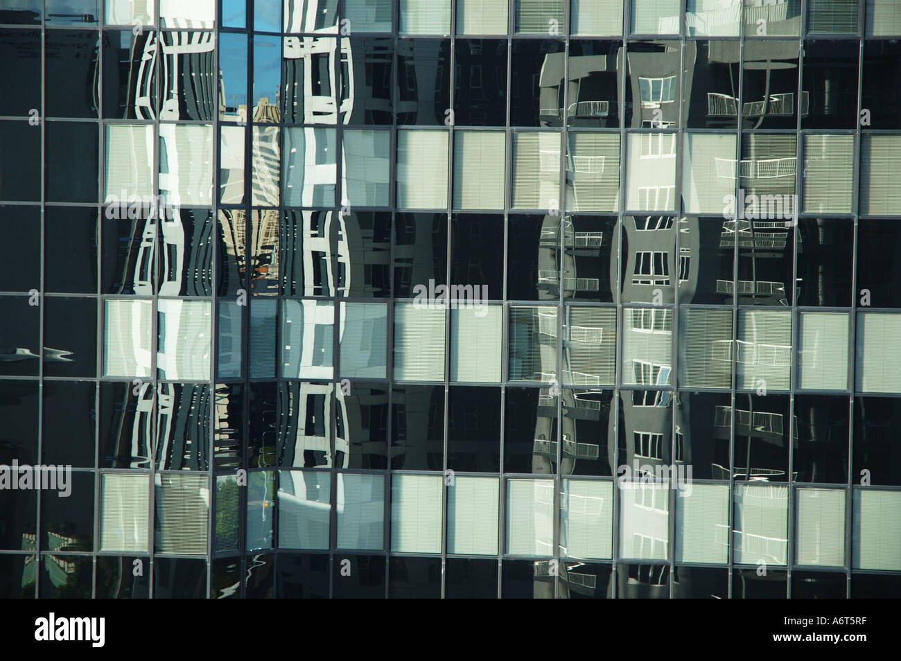 reflection in city office block windows Stock Photo - Alamy