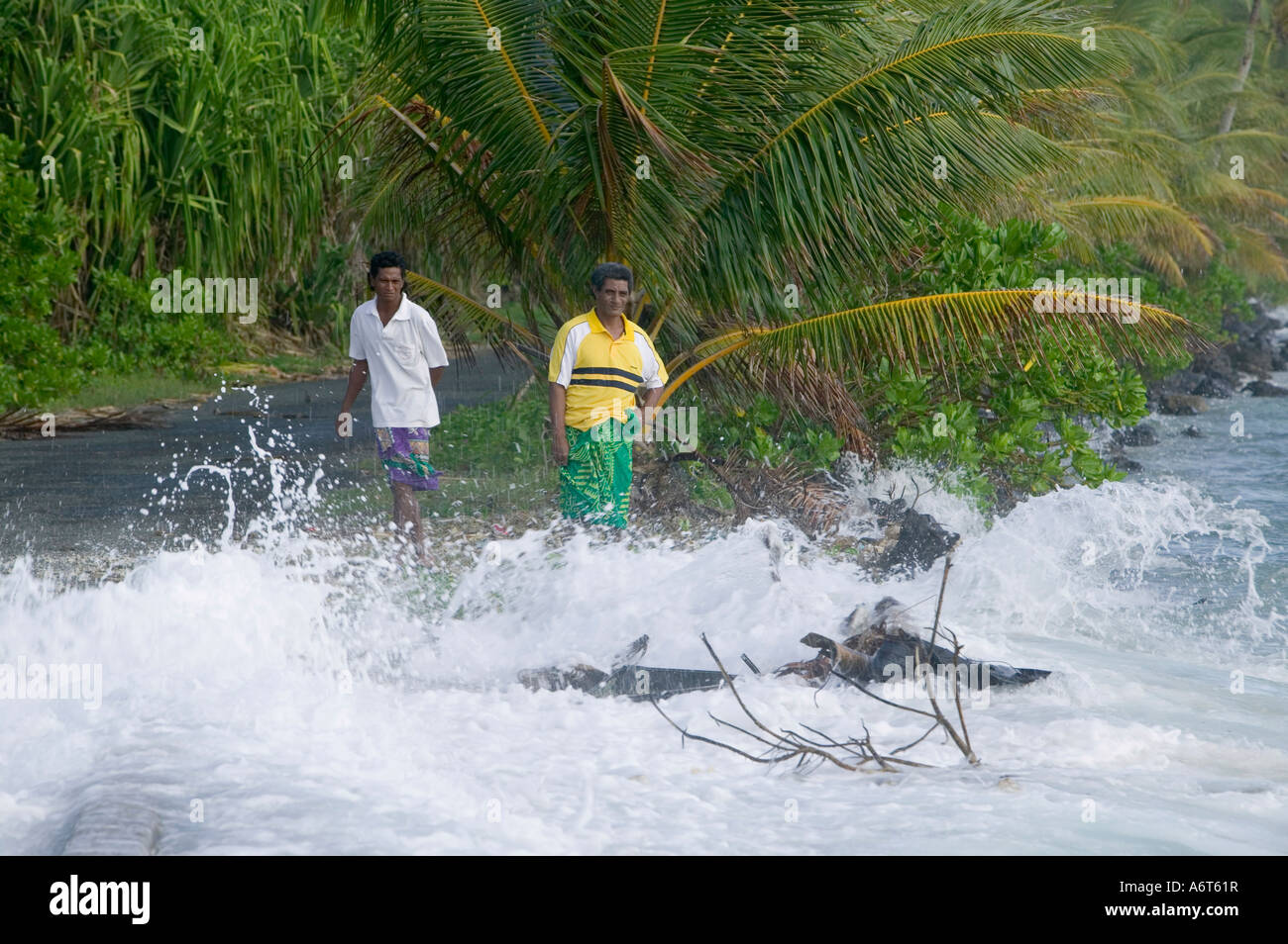 Tuvaluans watch as the high tide inundates their island home on ...