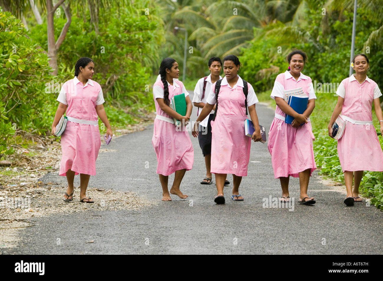 School girls walking back from school on funafuti, tuvalu Stock Photo ...