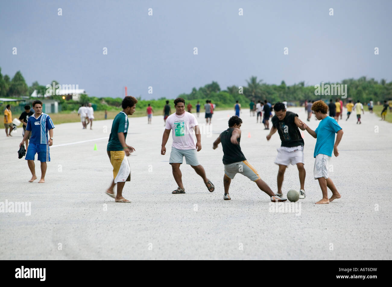 Tuvaluans playing football on the runway on Funafuti island Stock Photo ...