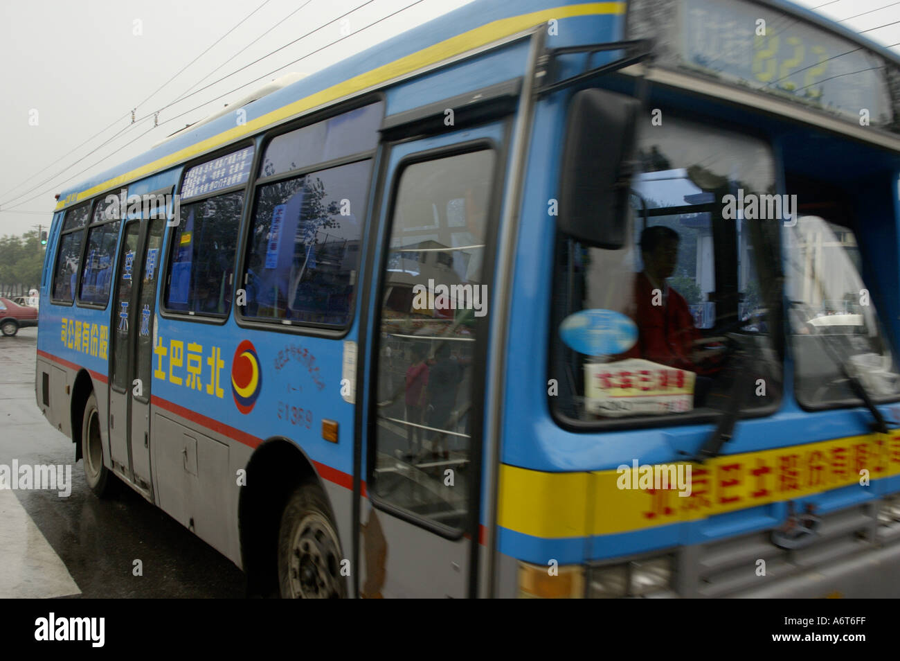China Beijing A Blurred Public Bus Driving On The Street Stock Photo ...
