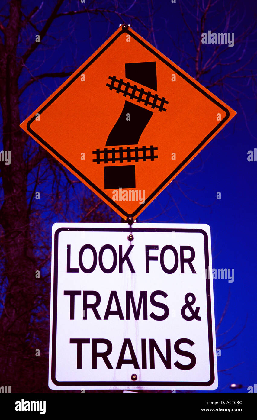 Look for trams and trains road sign Stock Photo - Alamy