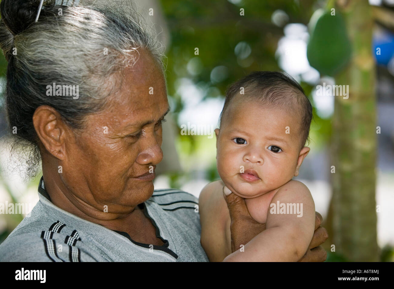 A Tuvaluan grandmother and grandchild on Funafuti island Stock Photo ...