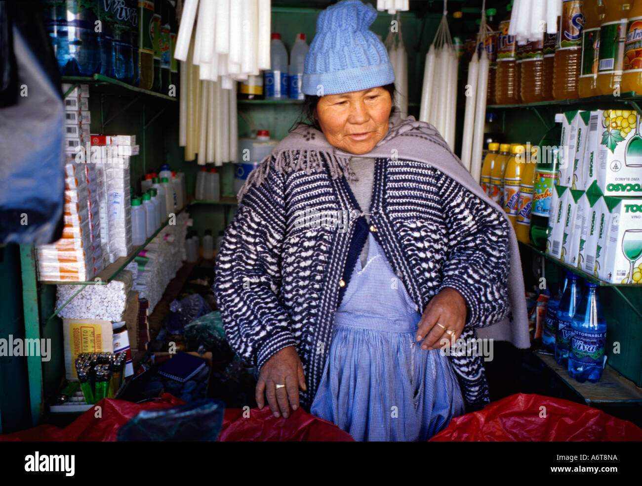 Old woman in tiny shop in Potosi Bolivia selling dynamite coca leaves ...