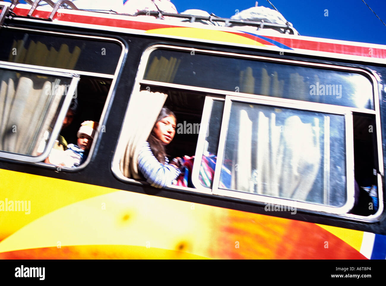 Indigenous girl and baby on colourful local bus in Bolivia Stock Photo ...